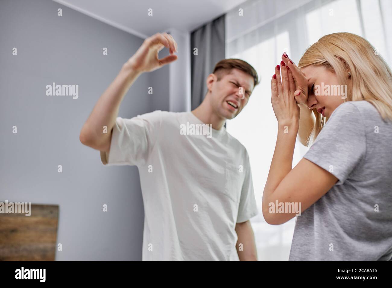 mentally unbalanced man beats his wife at home, defenseless woman tries ...