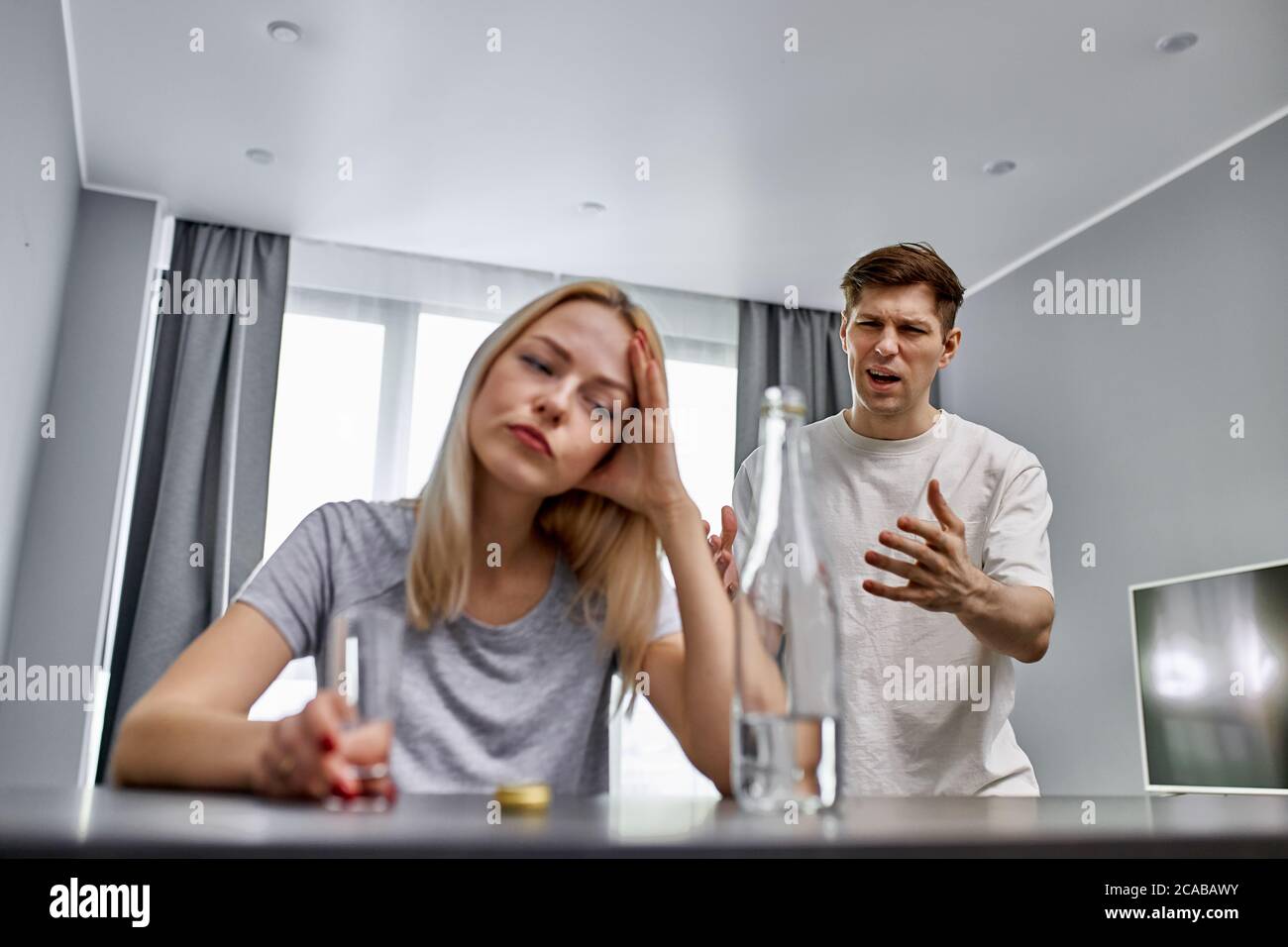 husband dissatisfied with his wife an alcoholic, angry man look at ...