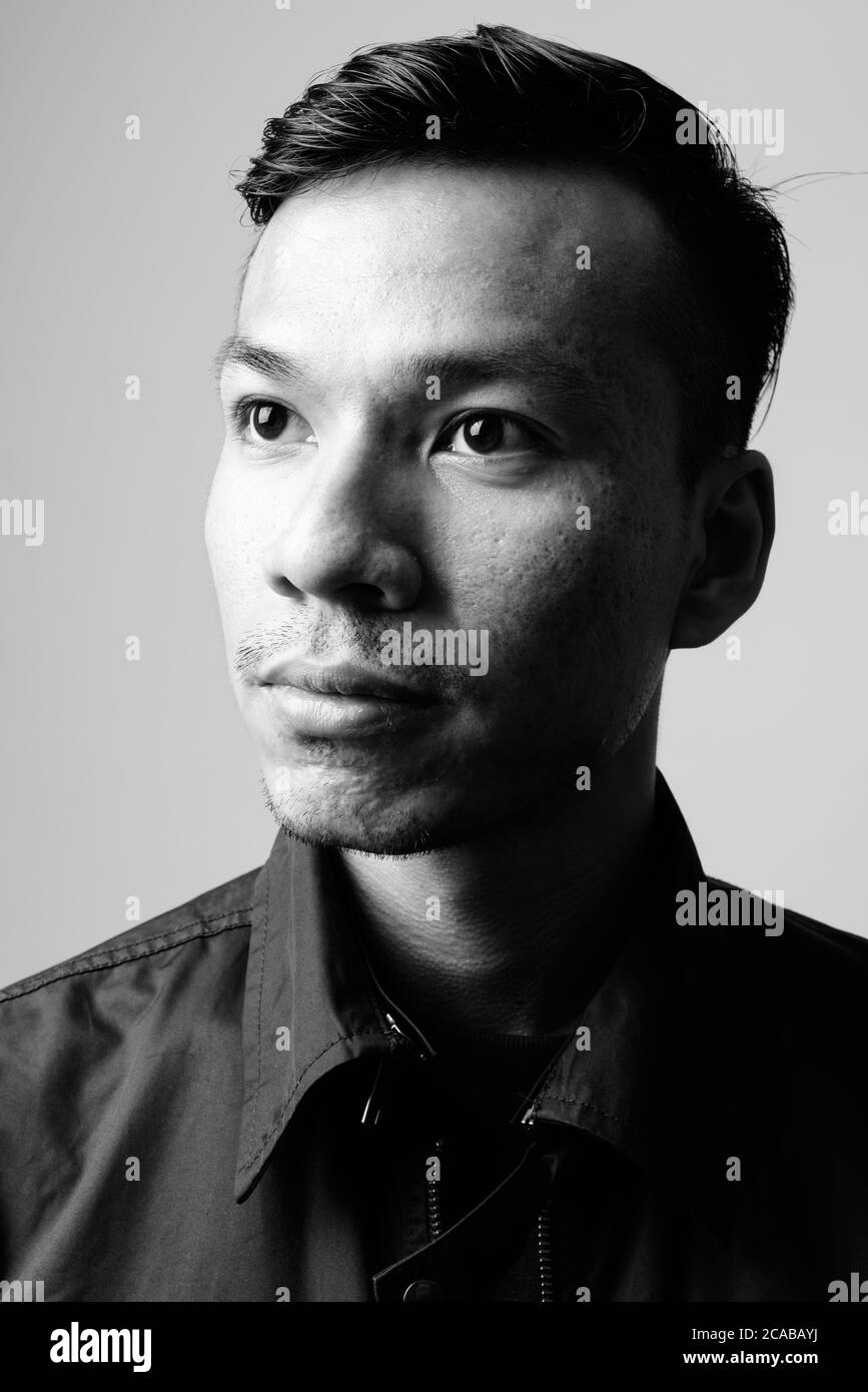 Portrait pensive asian young Black and White Stock Photos & Images - Alamy