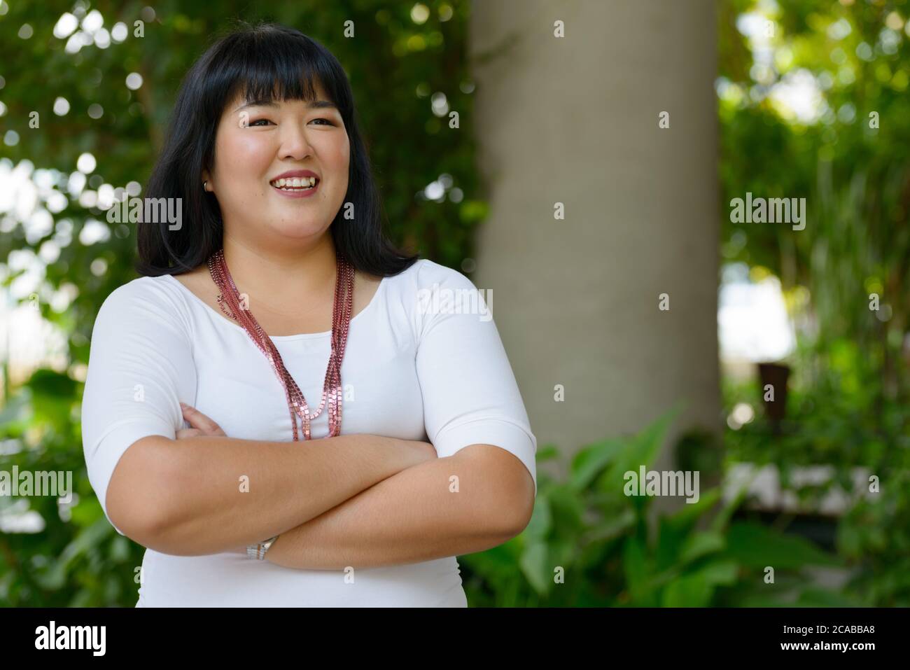 Happy young beautiful overweight asian hi-res stock photography and ...