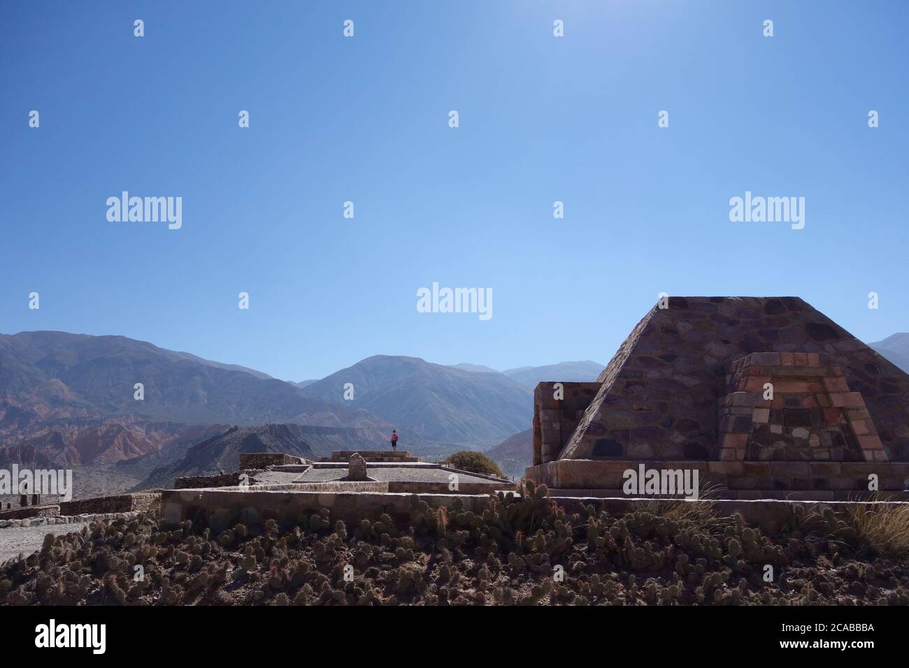 Sunny scenery of an old historical building on mountains background ...