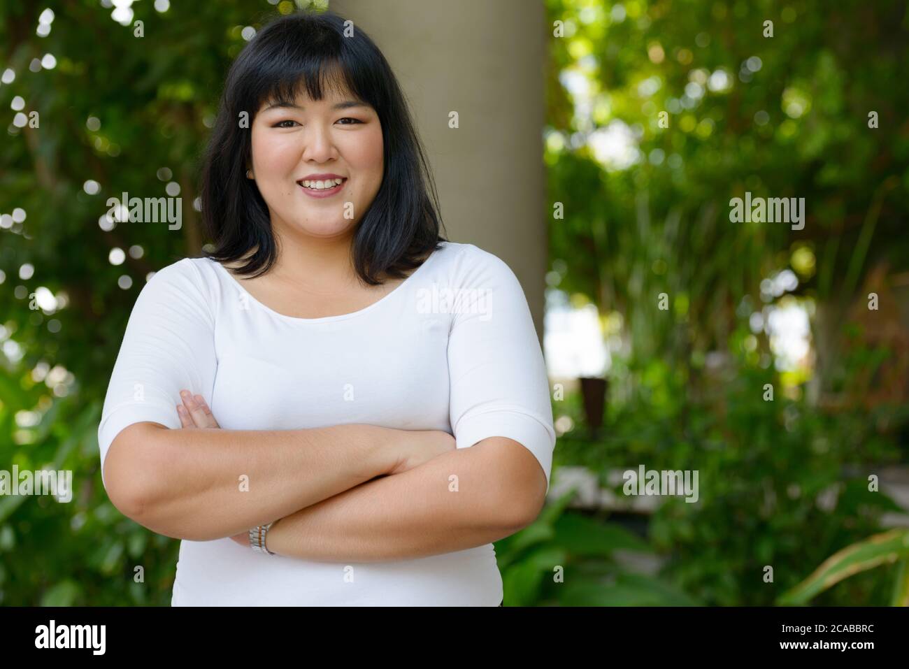 Happy young beautiful overweight asian hi-res stock photography and ...
