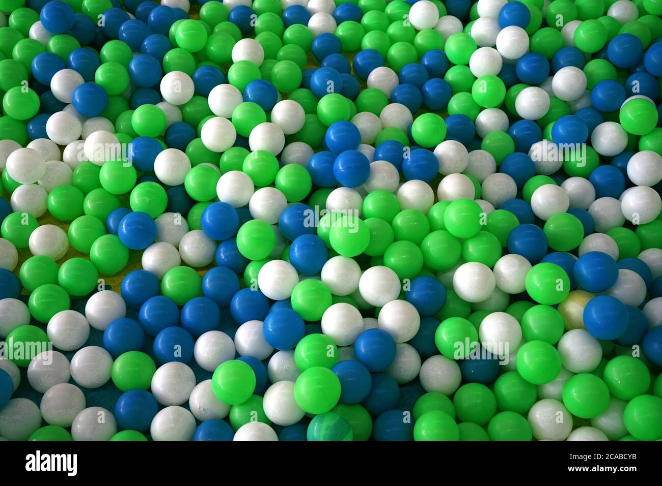 Colored plastic balls in the playground Stock Photo - Alamy