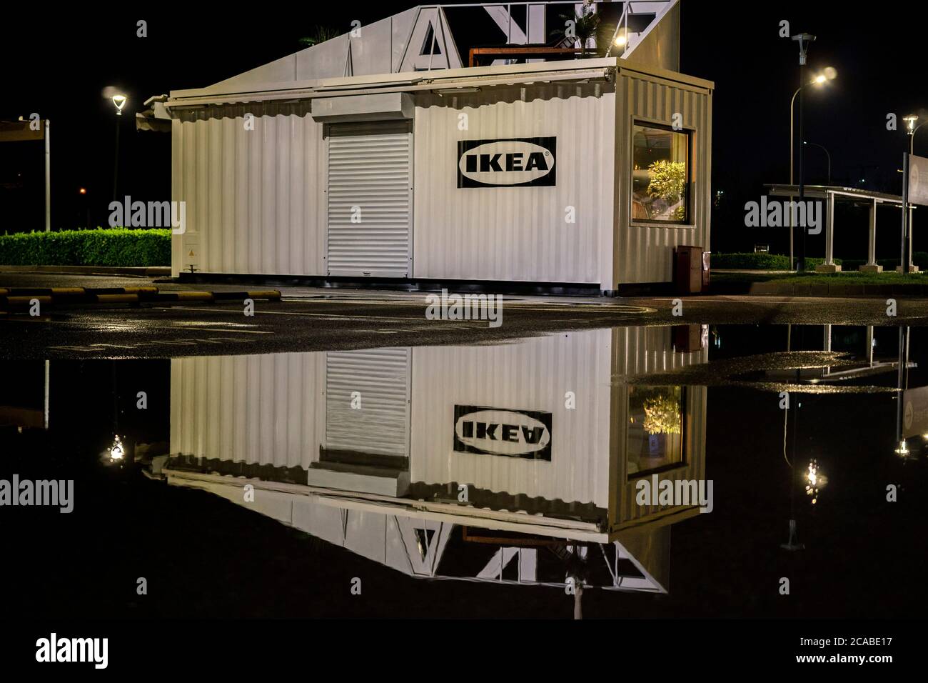 An IKEA booth, reflection in water Stock Photo - Alamy