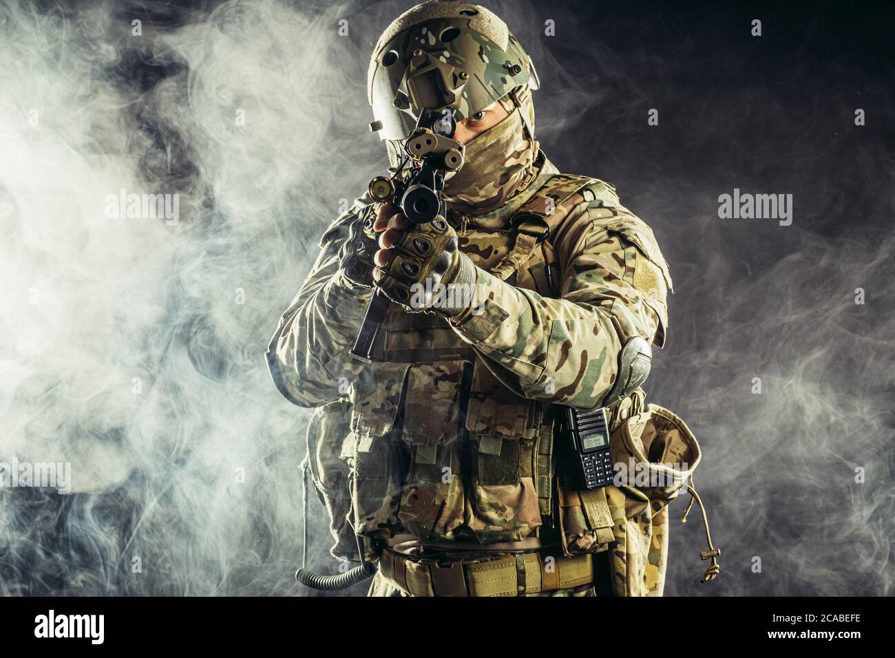 military forces concept., young brave soldier holding weapon looking ...
