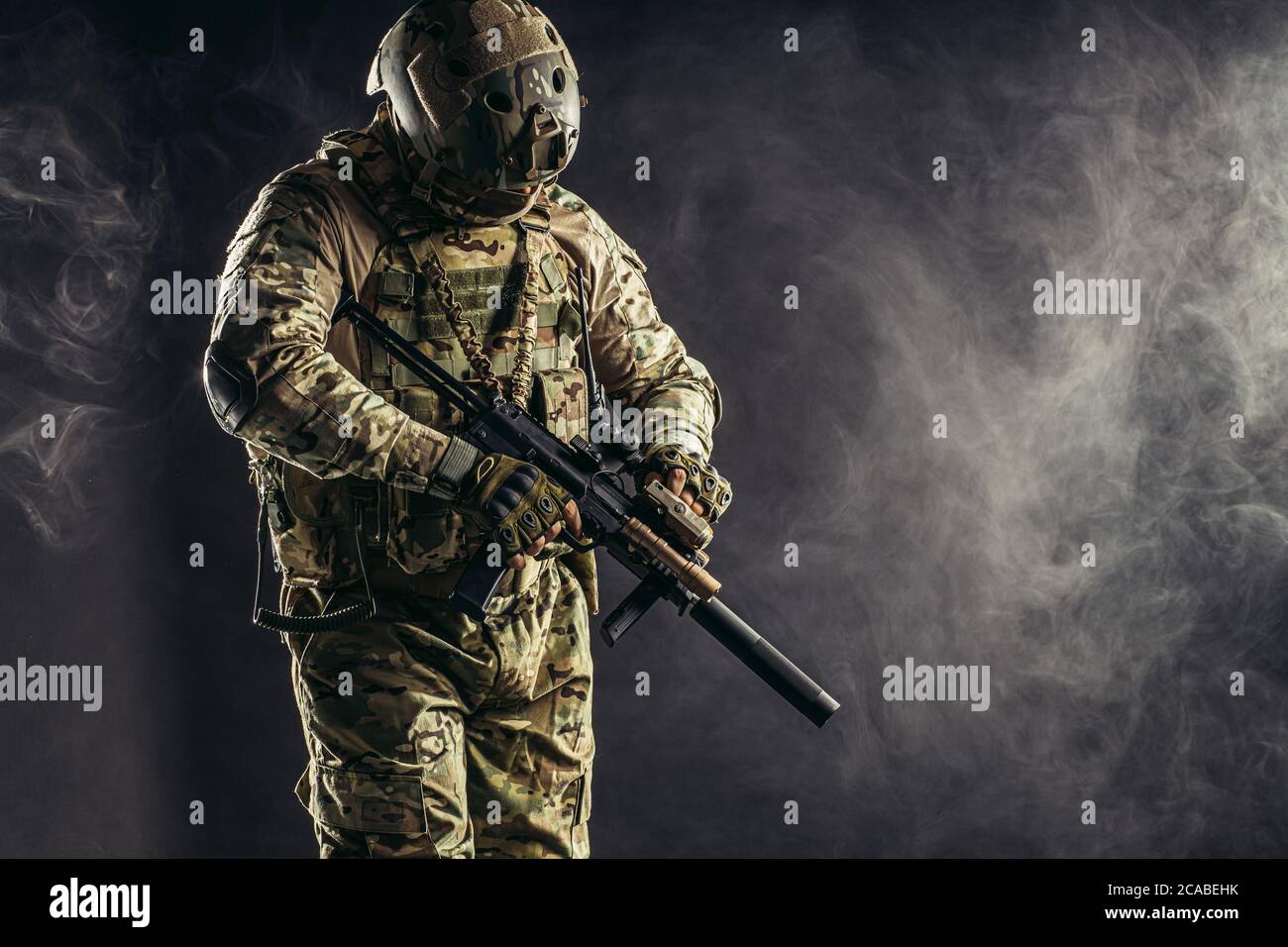young military man soldier holding gun, wearing special services ...