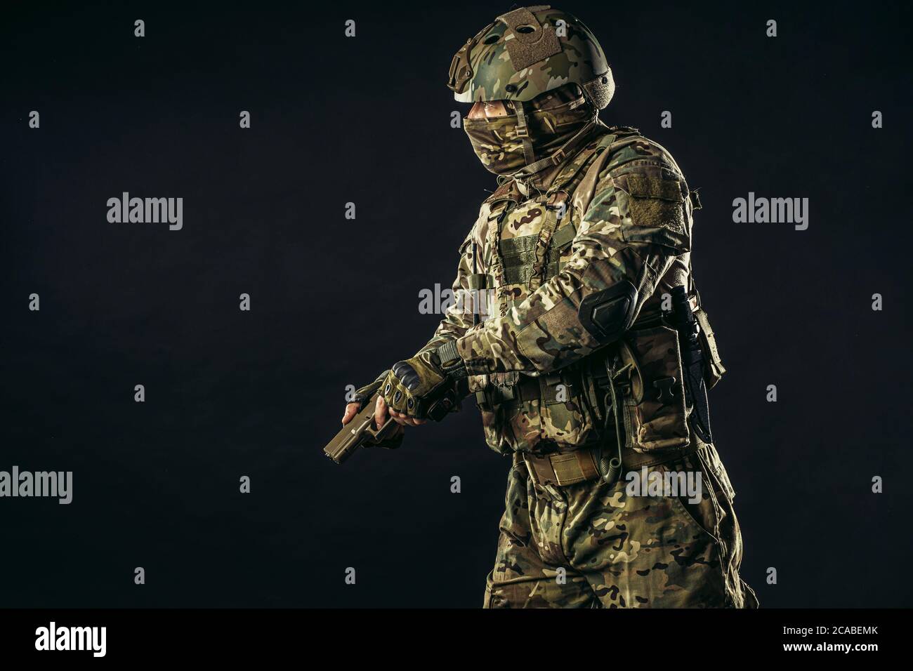 fearless brave strong man with gun isolated in black space, in ...