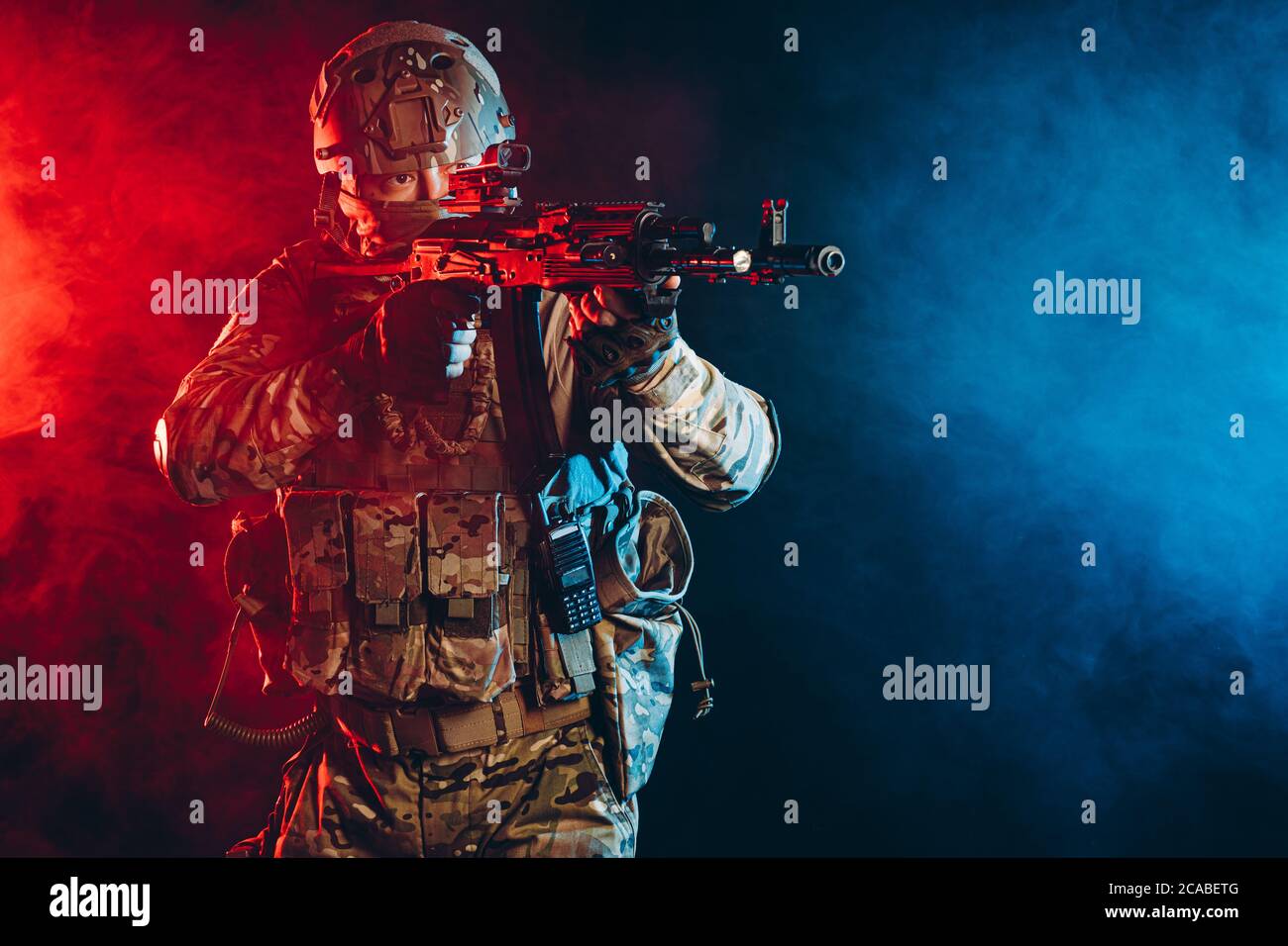warrior military man wearing green uniform stand with gun rifle ...