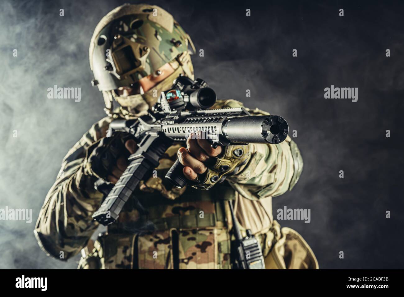 brave and strong soldier in military uniform holding rifle in hands ...