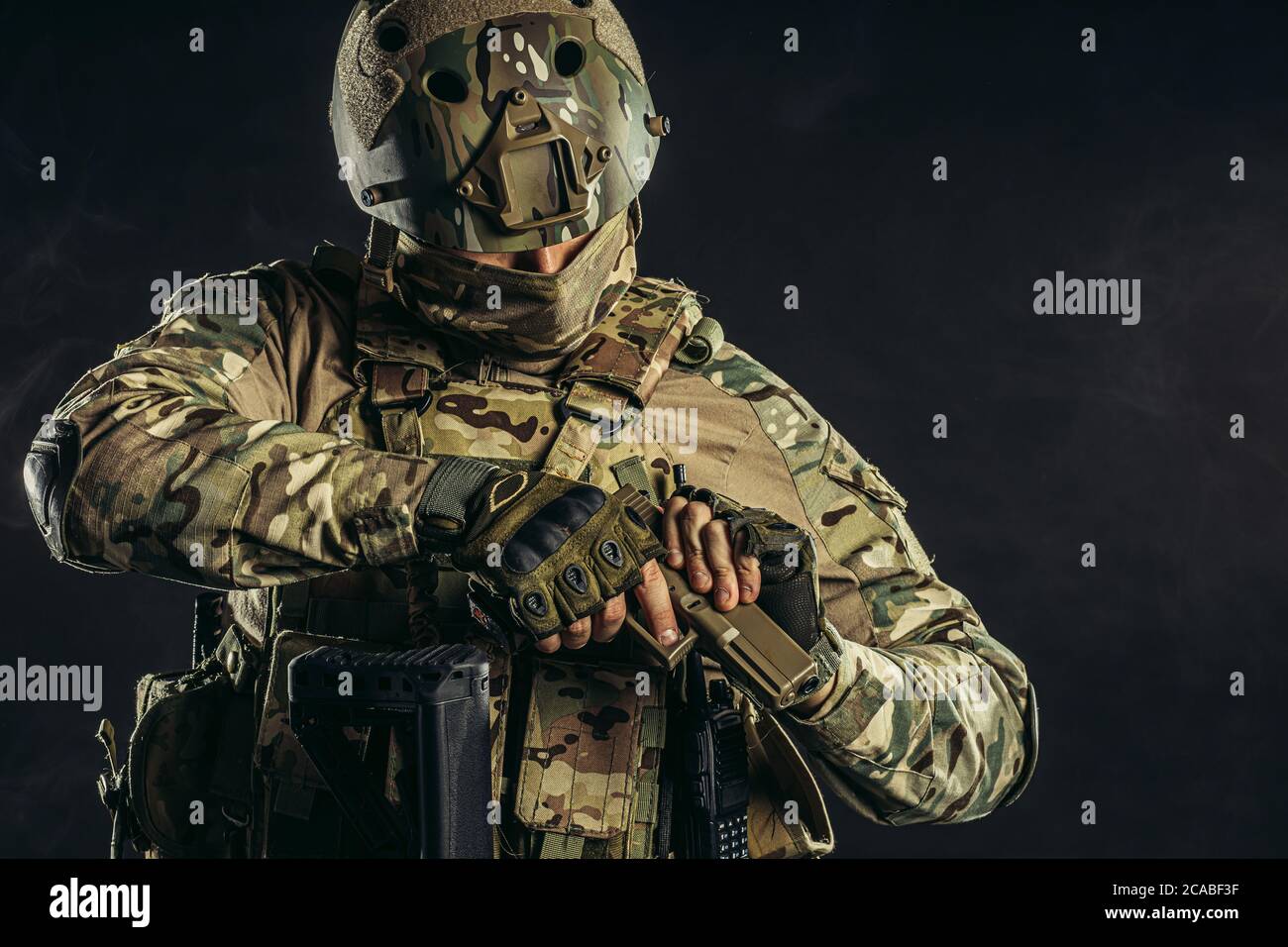 fearless brave strong man with gun isolated in black space, in ...