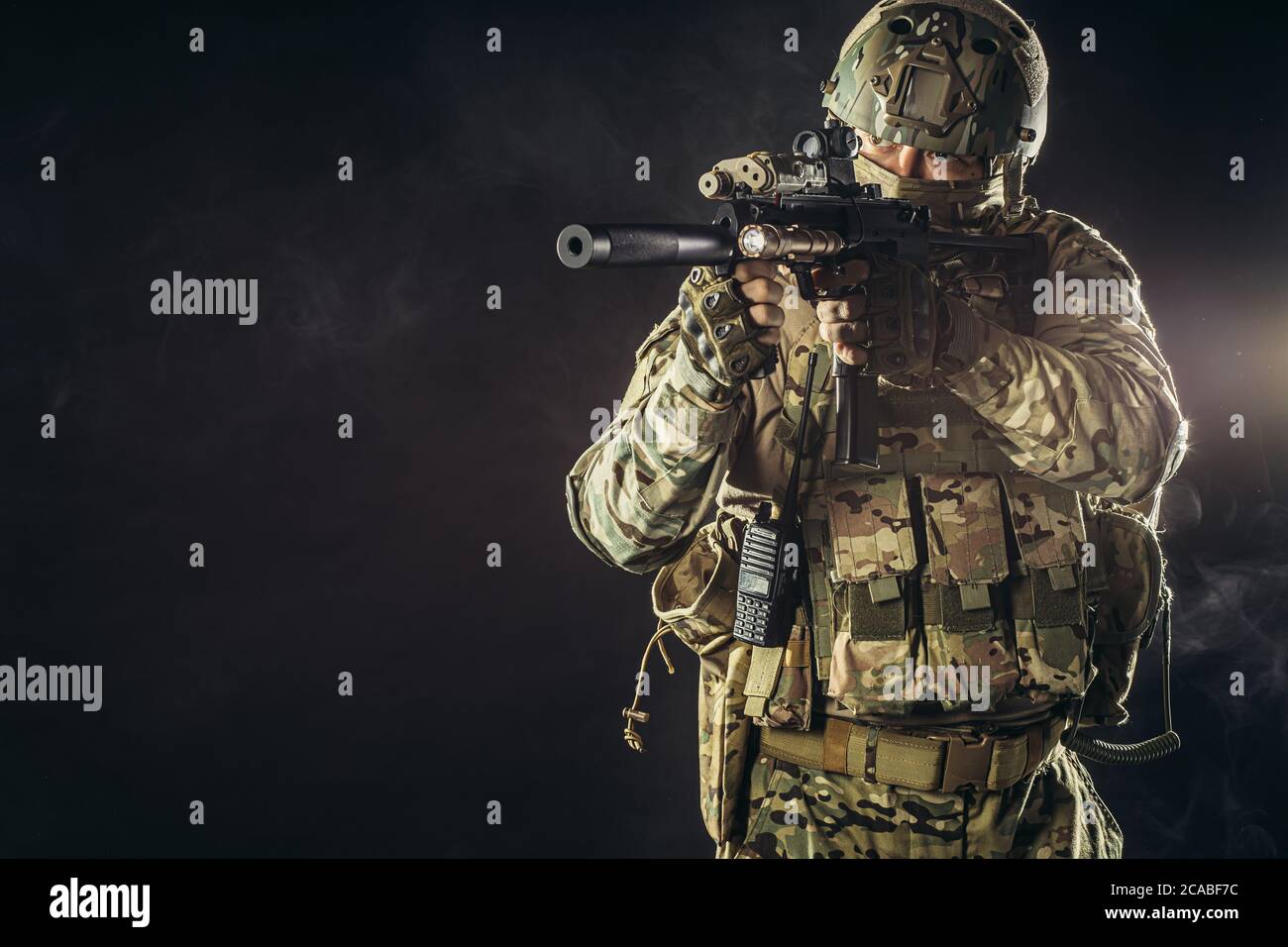 military forces concept., young brave soldier holding weapon looking ...