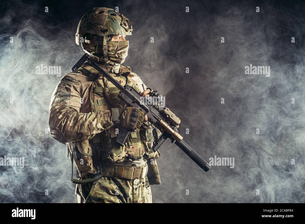 young soldier of russian military forces stand in smoky foggy space ...