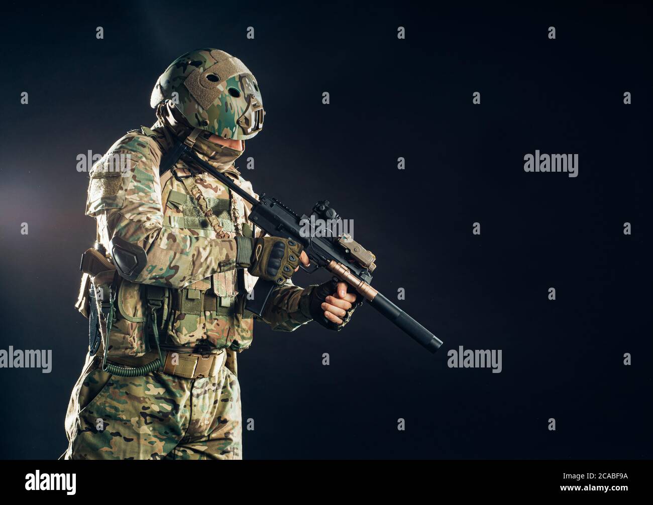 portrait of adult carrying out military service, soldier man with rifle ...