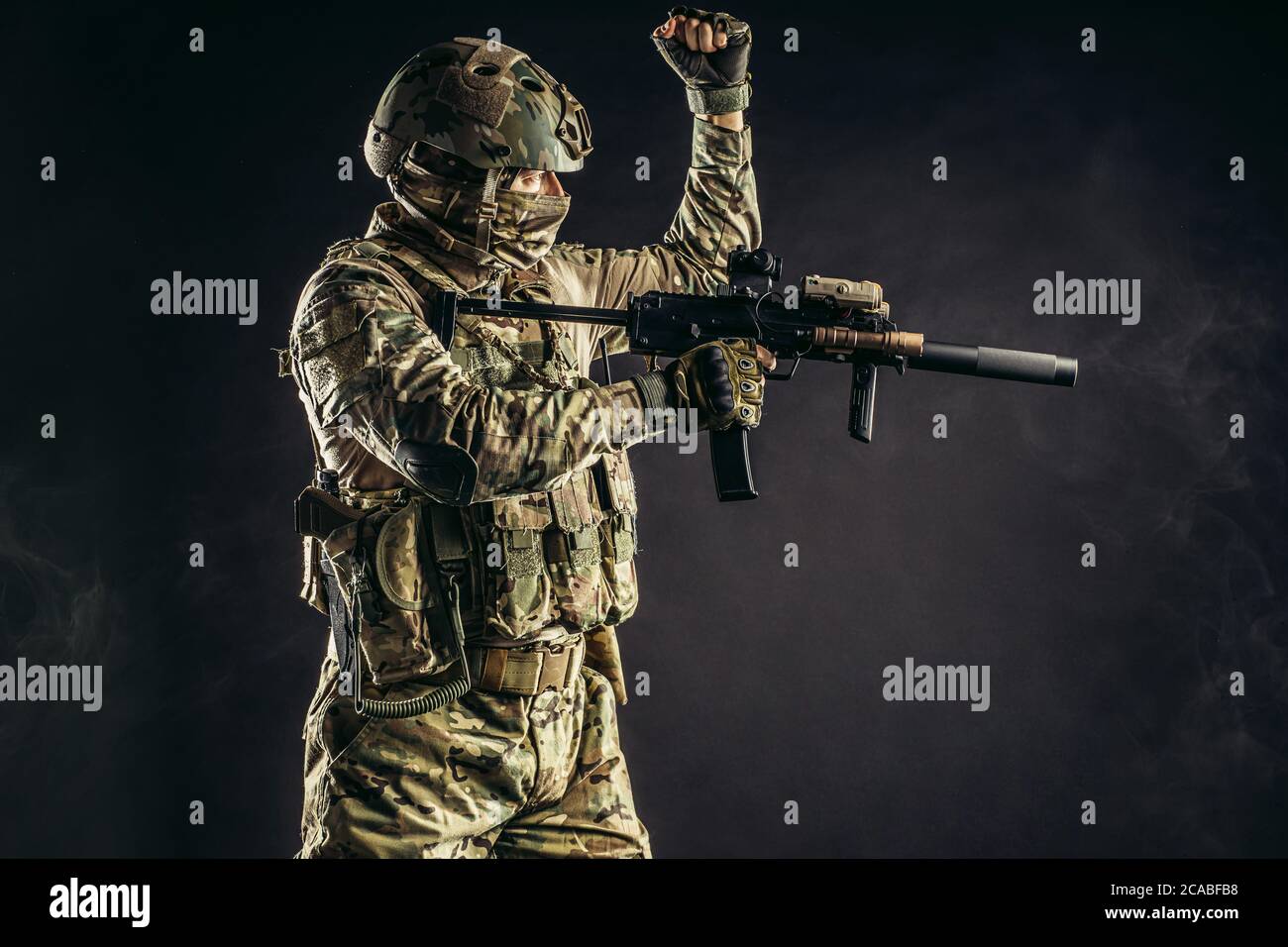 young soldier of russian military forces stand in smoky foggy space ...