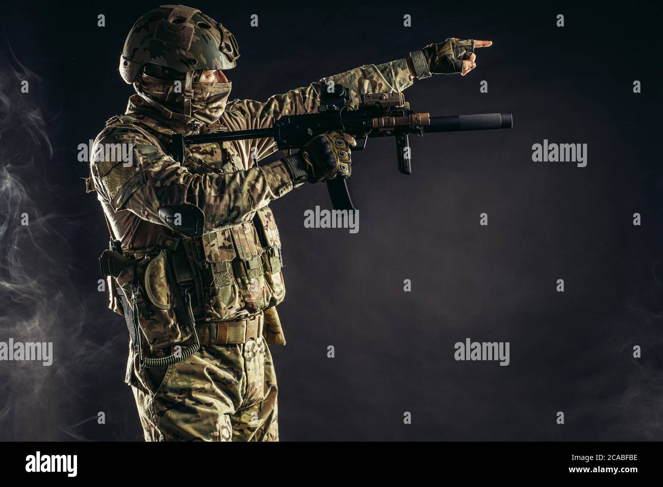 soldier man in green military uniform hold rifle in hands, shoot at ...
