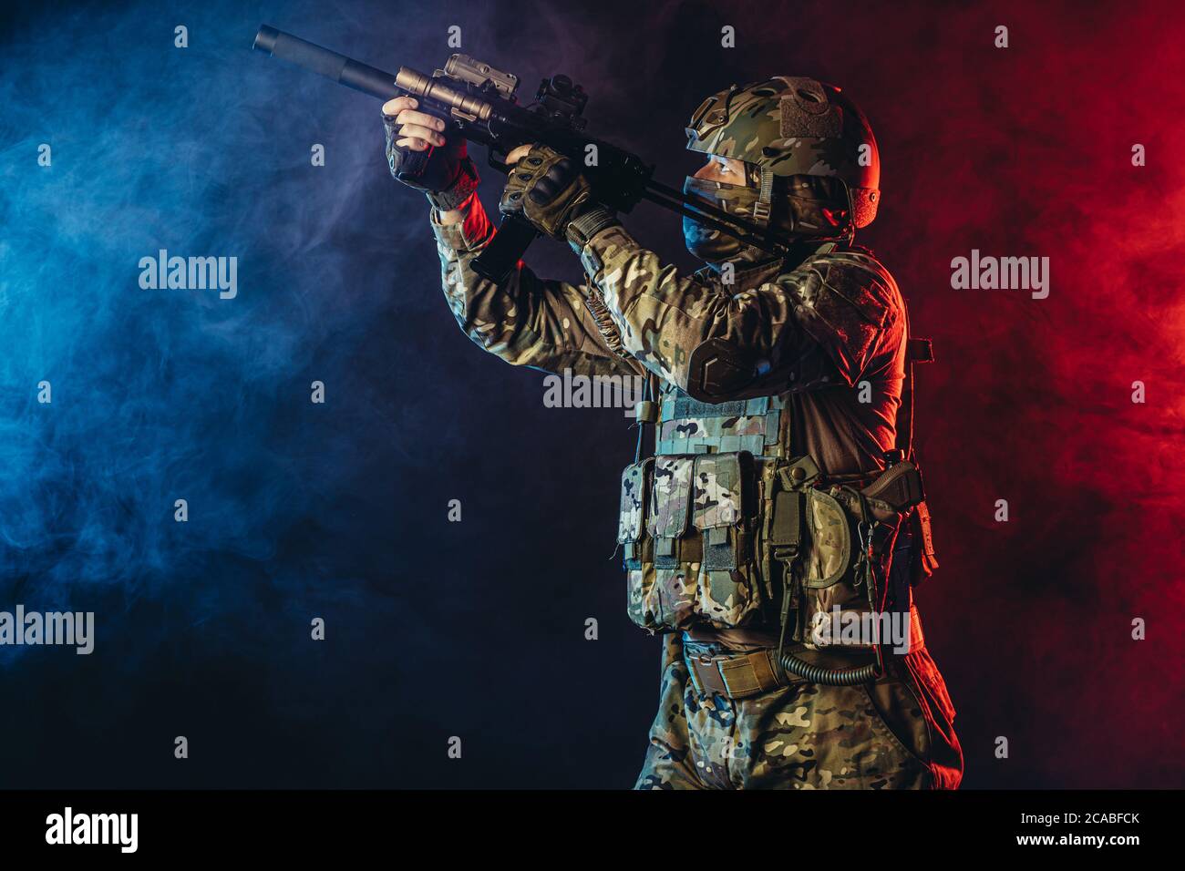 militant soldier man in action, wearing green uniform with special ...