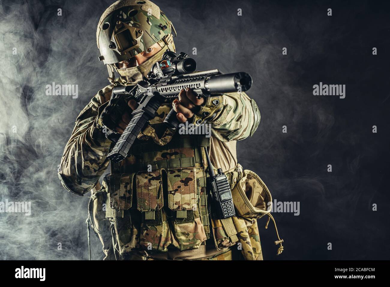 young soldier of russian military forces stand in smoky foggy space ...