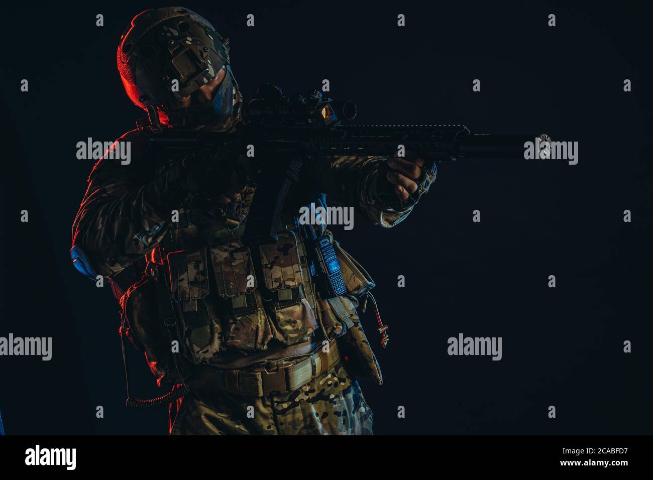 brave military man shooting weapon and wearing uniform, serving in ...