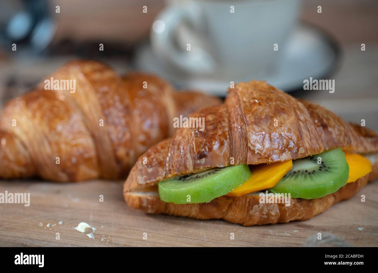 healthy breakfast: croissant sandwich with fruits Stock Photo - Alamy
