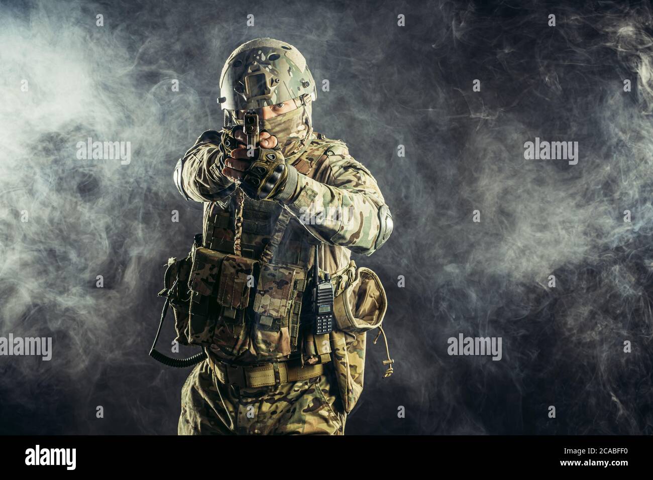 brave and strong soldier in military uniform holding rifle in hands ...