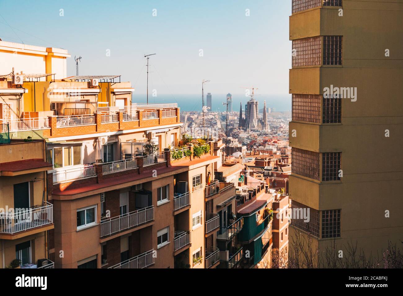 A view of La Sagrada Familia basilica between apartment blocks of the ...