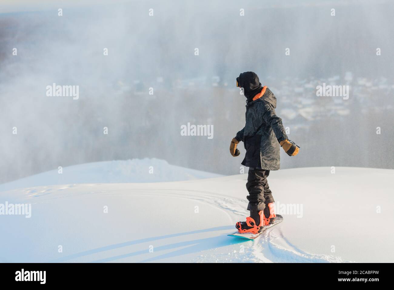 full length back view photo. young man moving slowly down a hill. copy ...