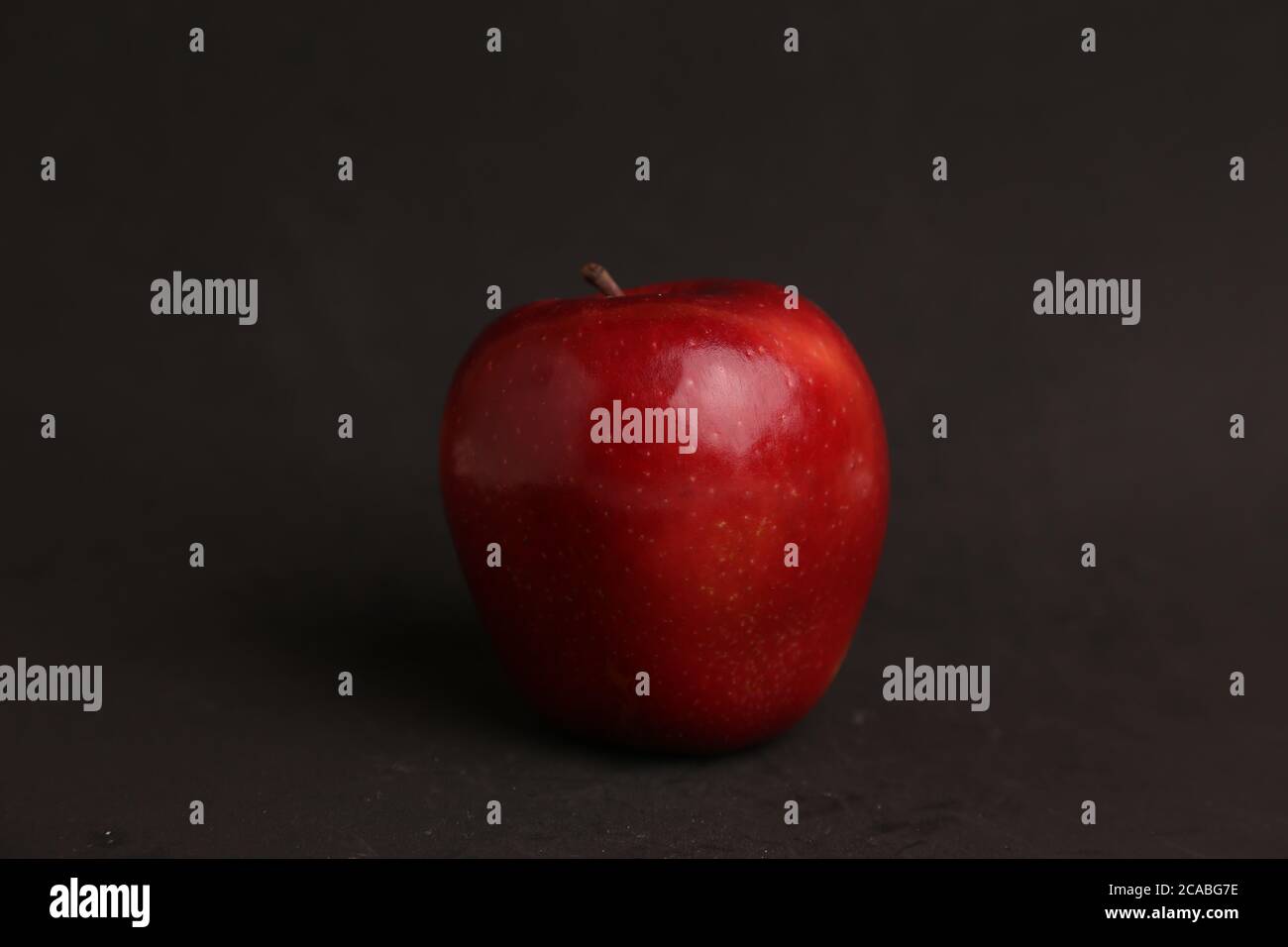 Red juicy apple isolated on black background Stock Photo - Alamy