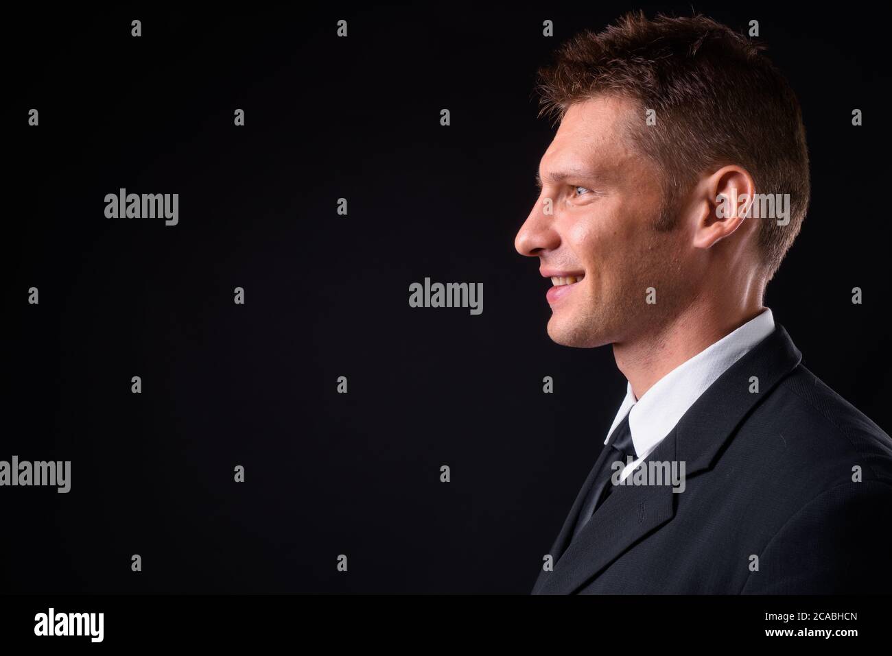 Smiling caucasian in black suit hi-res stock photography and images - Alamy