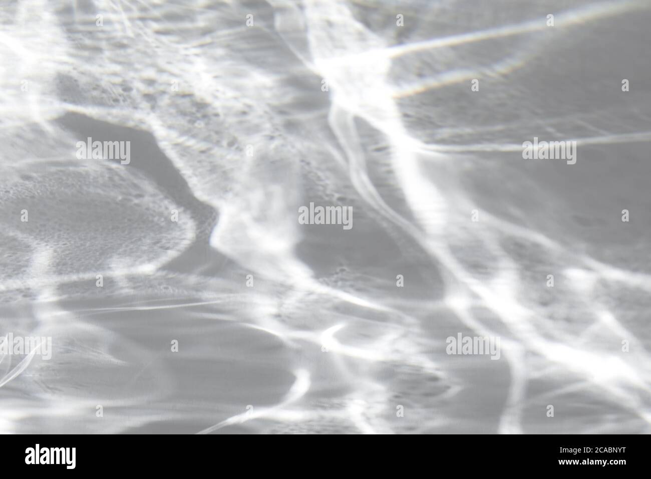 shadow and light caustic effect on a white wall Stock Photo - Alamy