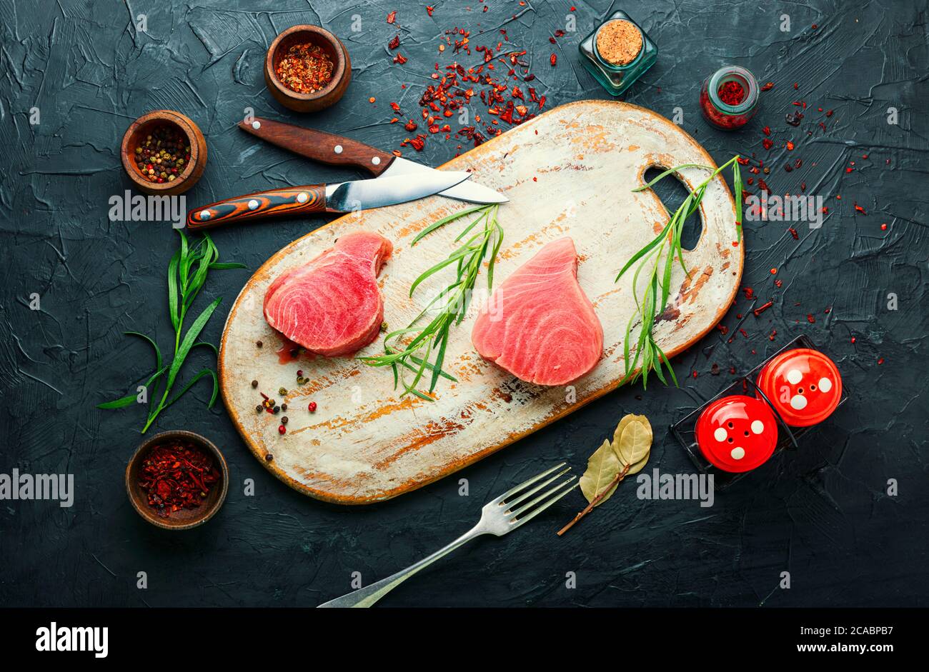Fresh raw tuna steak on kitchen board Stock Photo - Alamy