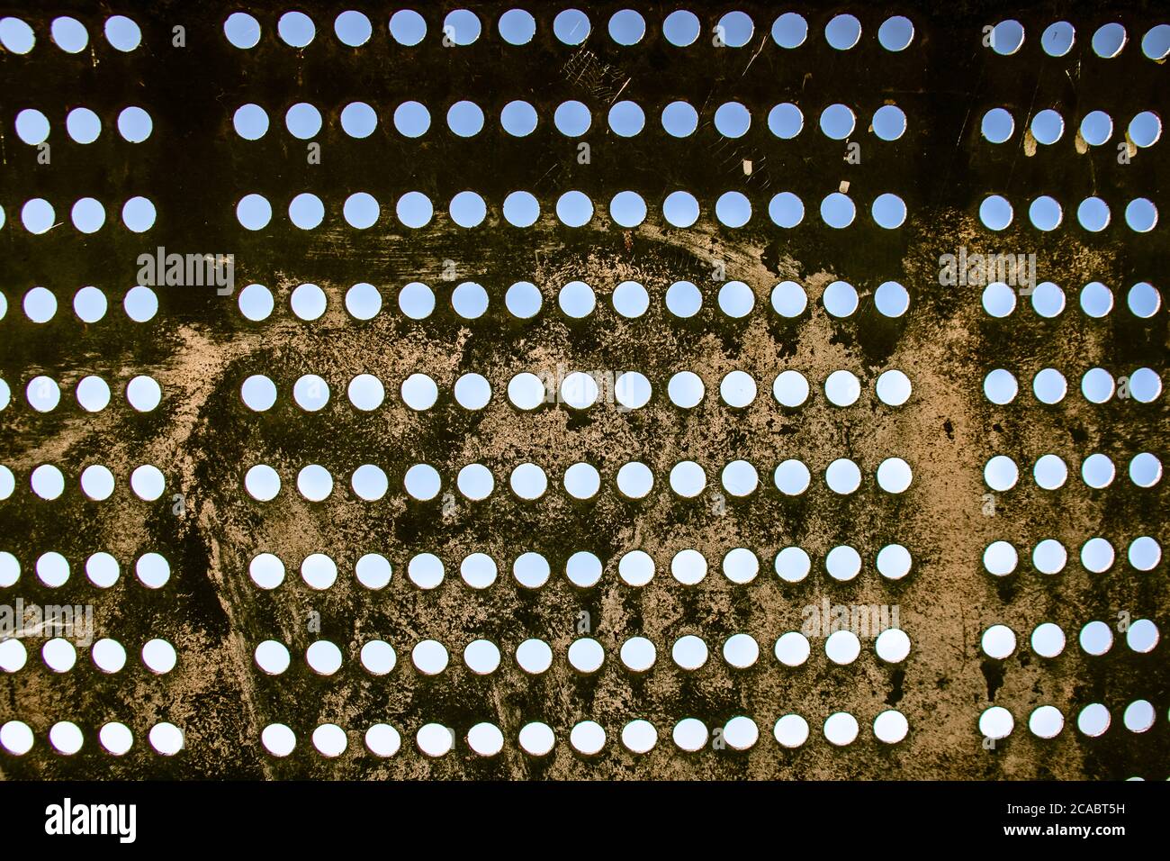 Metal structure with aligned holes. Grunge metal Stock Photo - Alamy