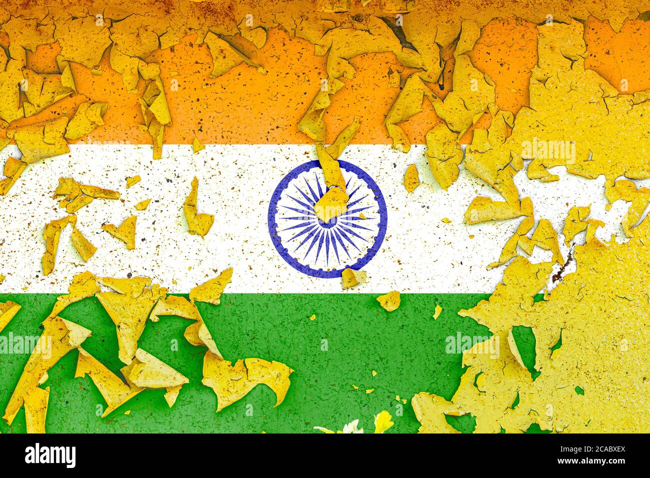 The national flag of India is painted on an old metal wall with ragged ...