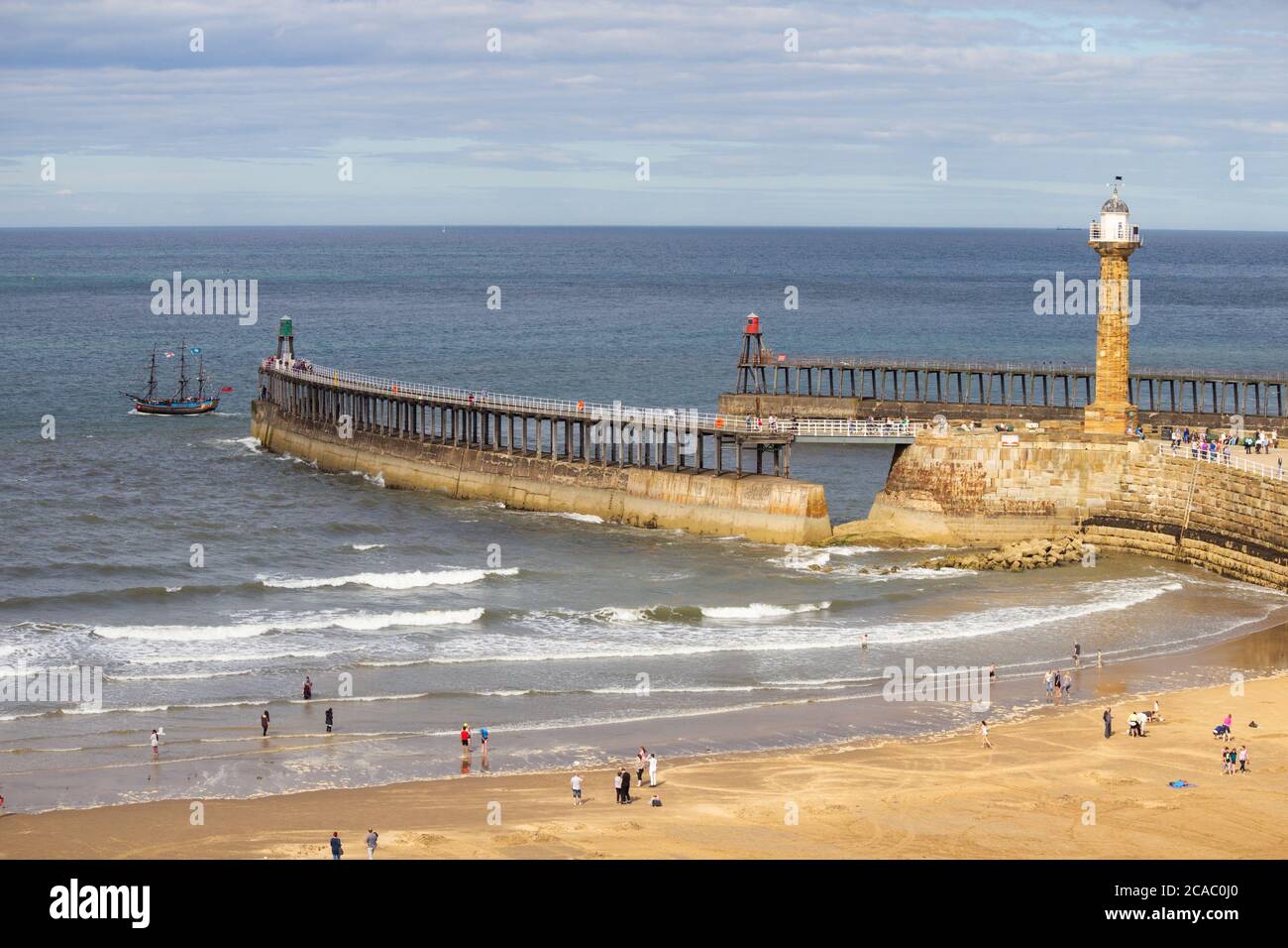 View over Whitby piers and beach. Whitby, North Yorkshire, England. UK ...
