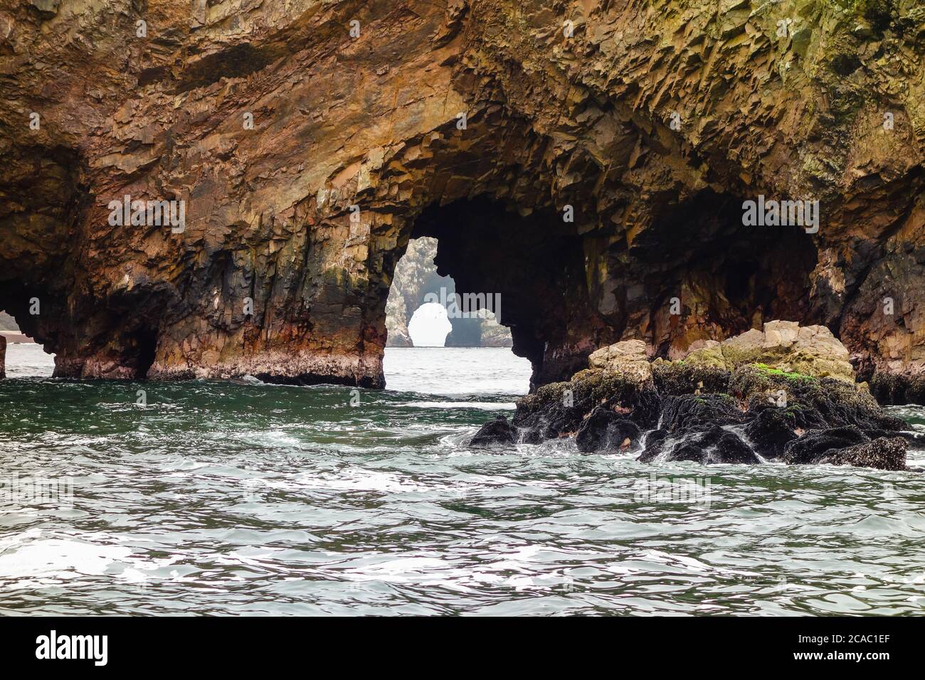 View of sea arcs and caves at Ballestas Islands National Reserve in ...