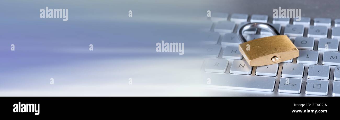 Padlock on computer keyboard; panoramic banner Stock Photo - Alamy