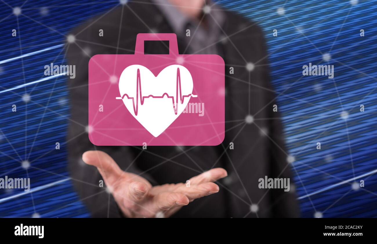 Cardiac emergency concept above the hand of a man in background Stock ...