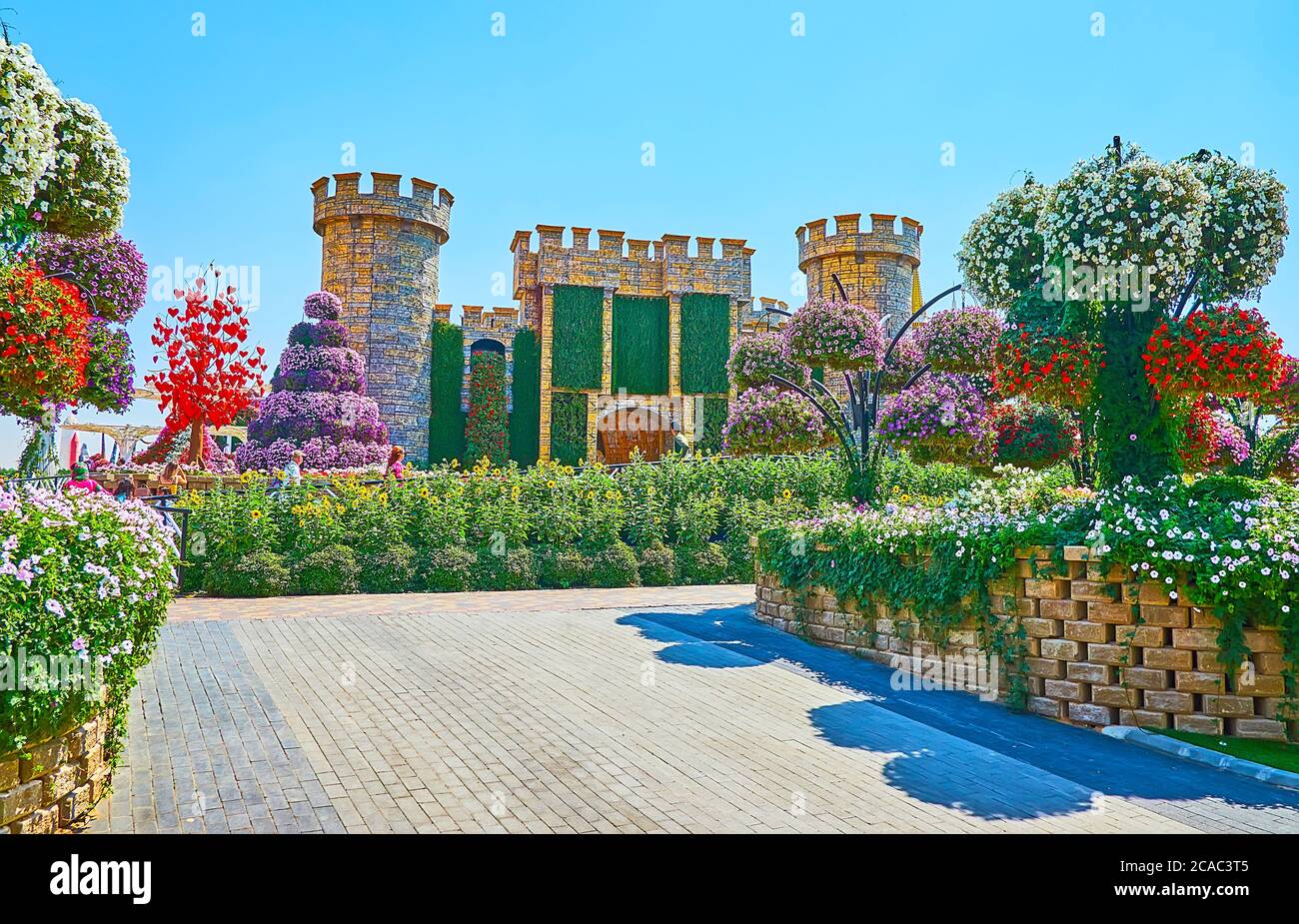 DUBAI, UAE - MARCH 5, 2020: The scenic small castle replica with lush ...
