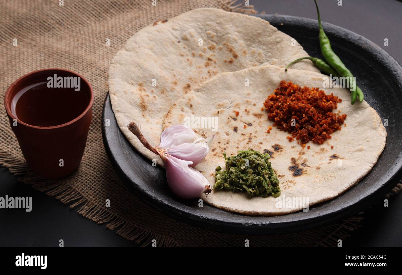 Green chilli chutney - thecha and garlic/lasun chutney. Served with ...