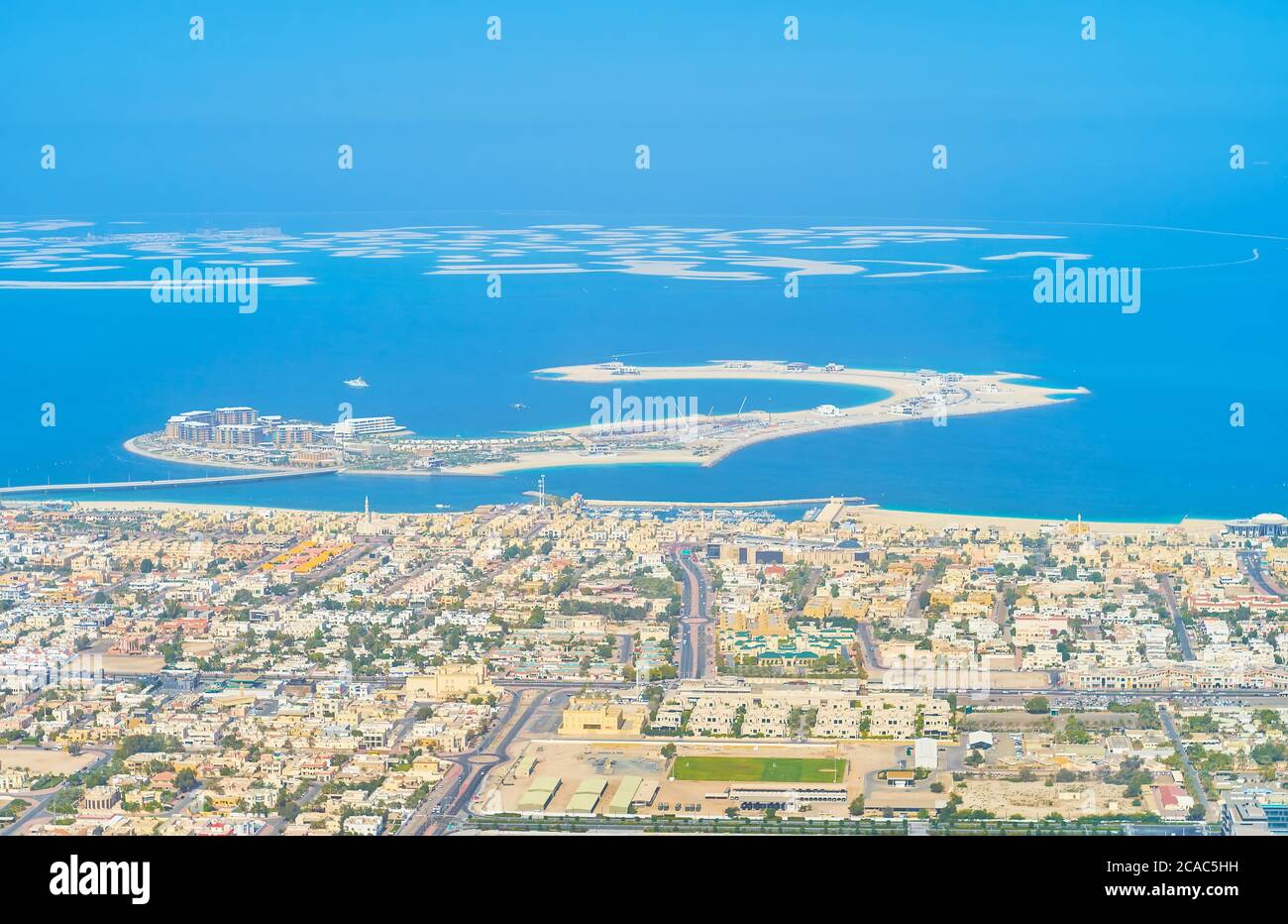 The aerial view on Dubai coastline with residential low-rise houses and ...