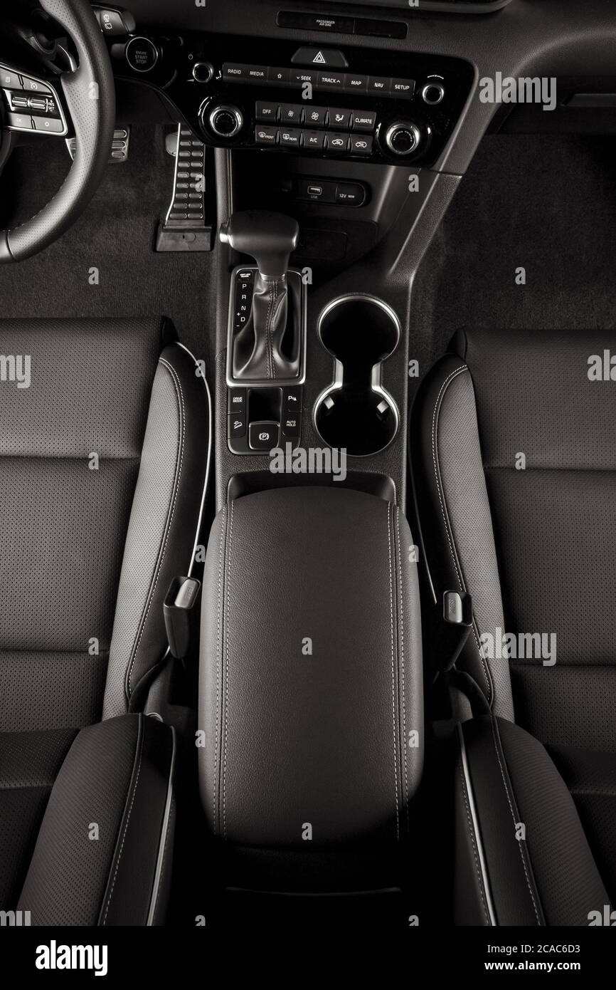 Vertical shot of a luxurious black interior of a modern elegant car ...