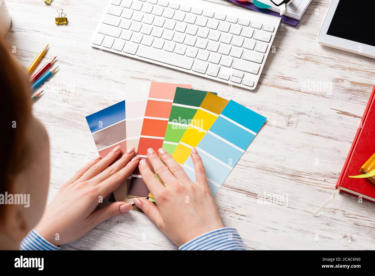 Interior designer choosing colors from swatches Stock Photo - Alamy