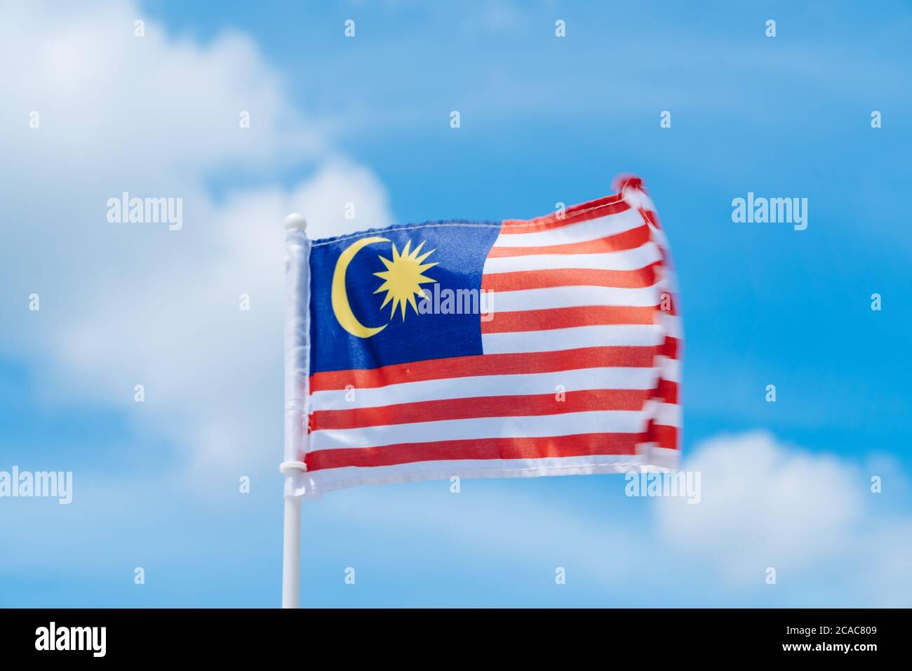 Wind blowing malaysian flag in hi-res stock photography and images - Alamy