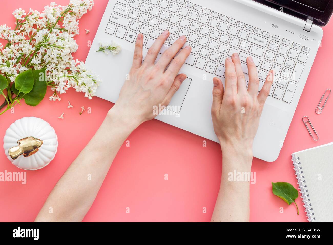 Woman s hands writing on office table desk with flowers. Education ...