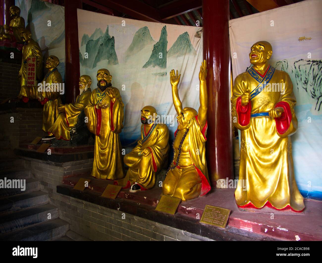 Closeup of a golden Shaolin monk's Statues in Shaolin Temple. The ...