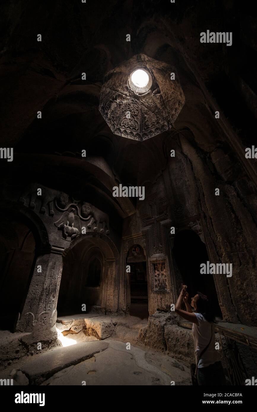 Geghard Monastery / Armenia - July 28, 2019: tourist woman taking ...