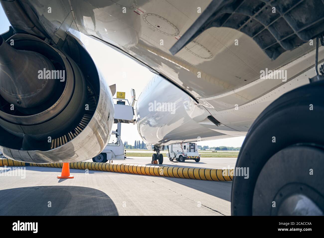 Airplane serviced during the refueling process at the airdrome Stock ...