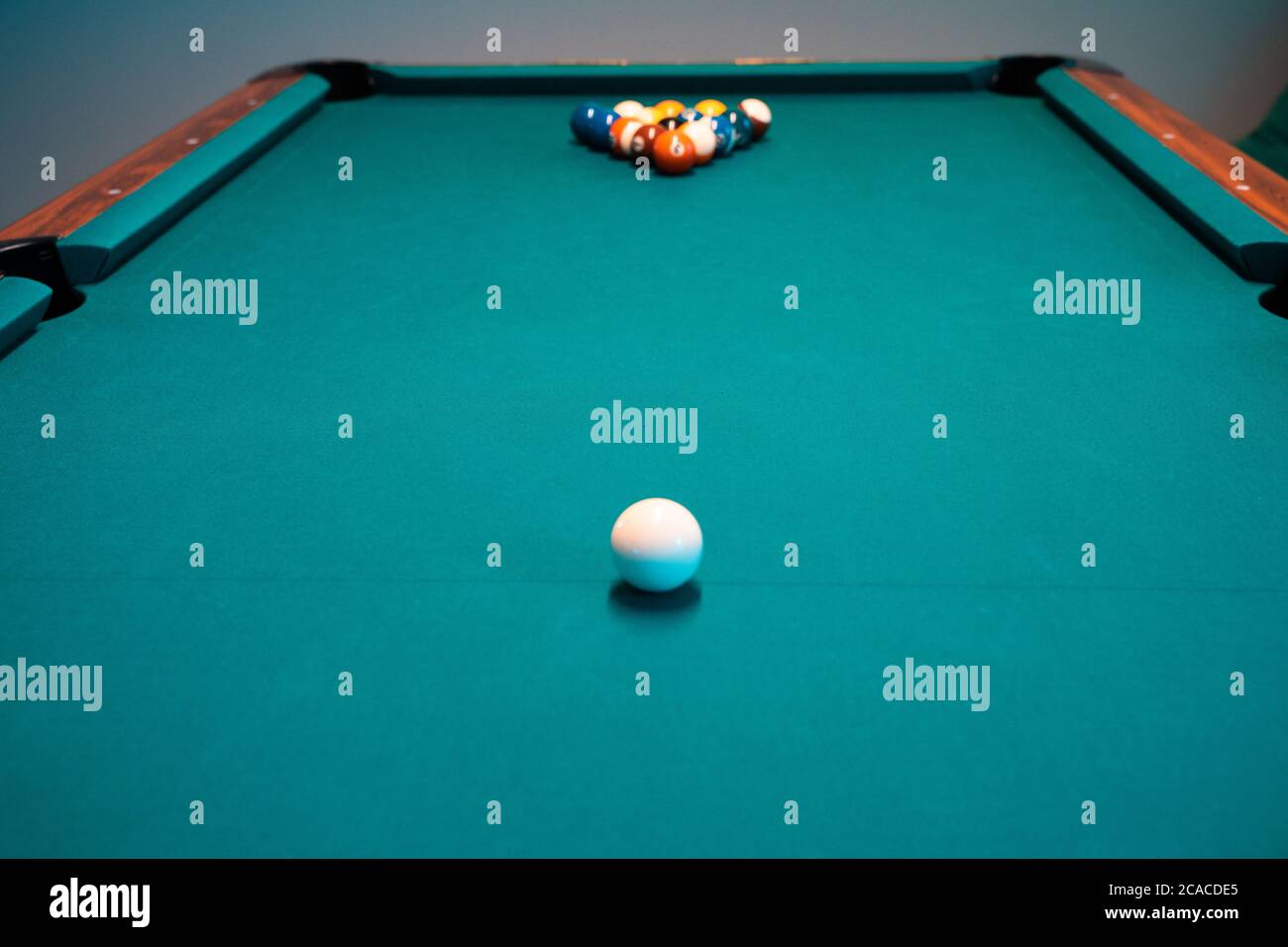 Billiard table with colorful and white balls Stock Photo - Alamy