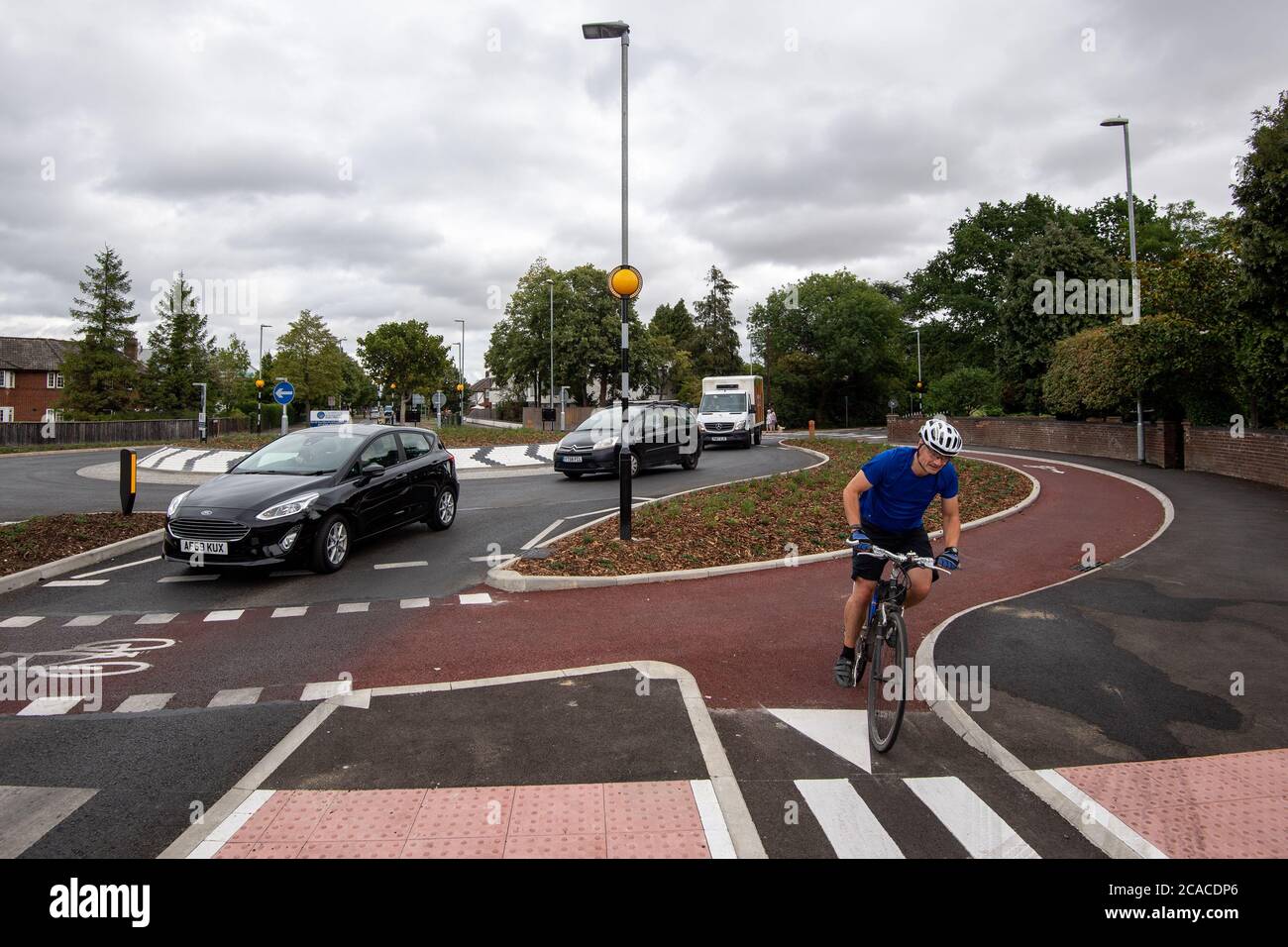 A cyclist uses uks first dutch style roundabout prioritises cyclists hi ...