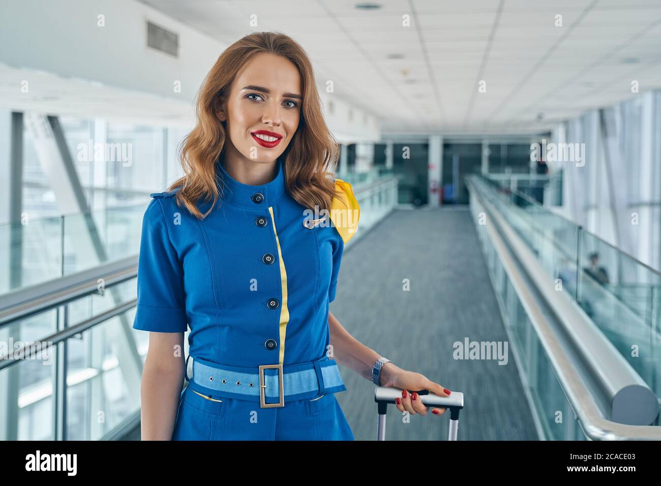 Elegant flight attendant woman hi-res stock photography and images - Alamy