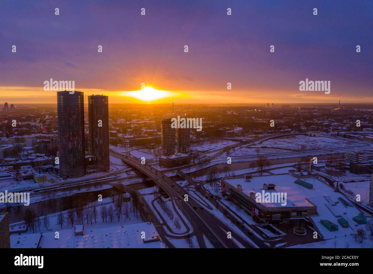 Aerial shot of the Z Towers in snowy Riga, Latvia during purple orange ...